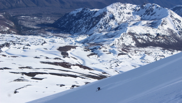 PowderQuest ski guide skiing off the top of the volcano in Nevados de ...